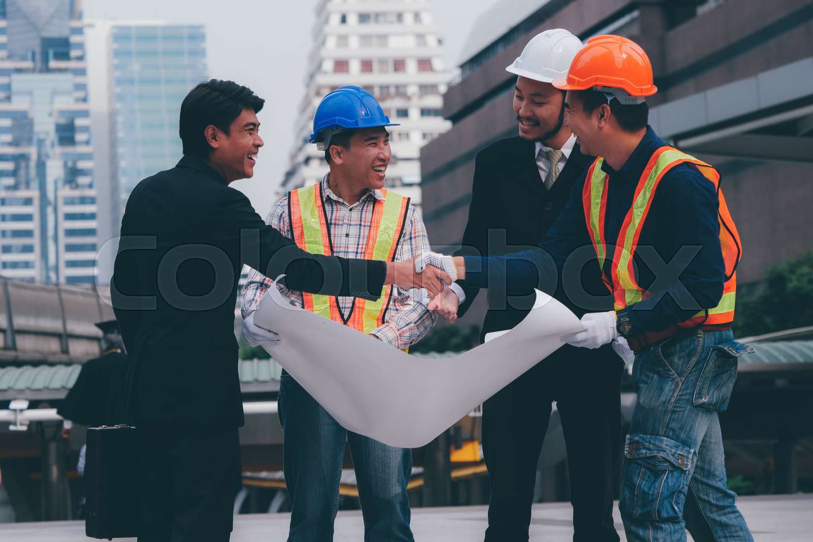 Engineering grop working together at outdoor,happy Teamwork concept ...