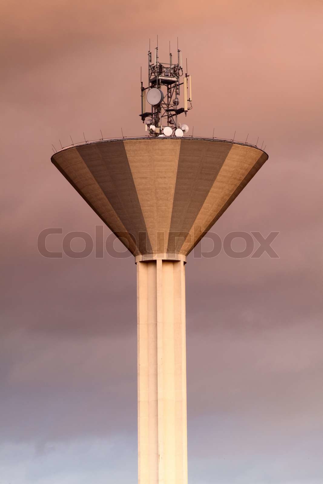 Modern water tank tower with communications antennas | Stock image ...