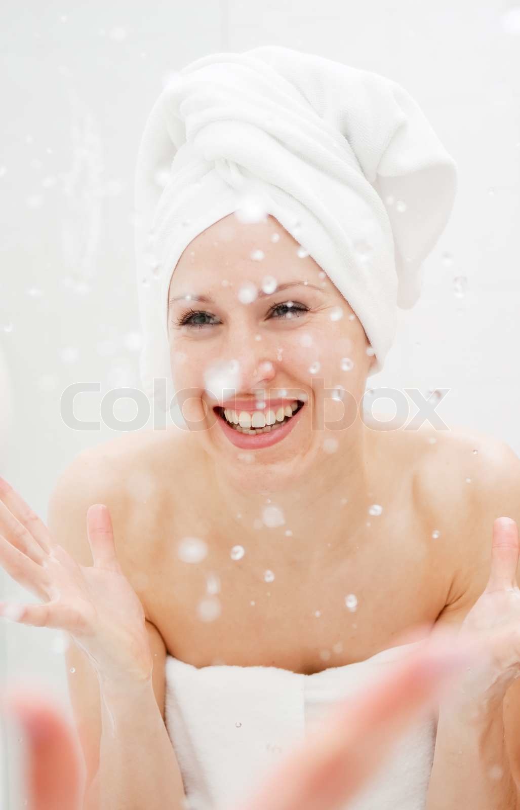 smiley woman washing herself | Stock image | Colourbox