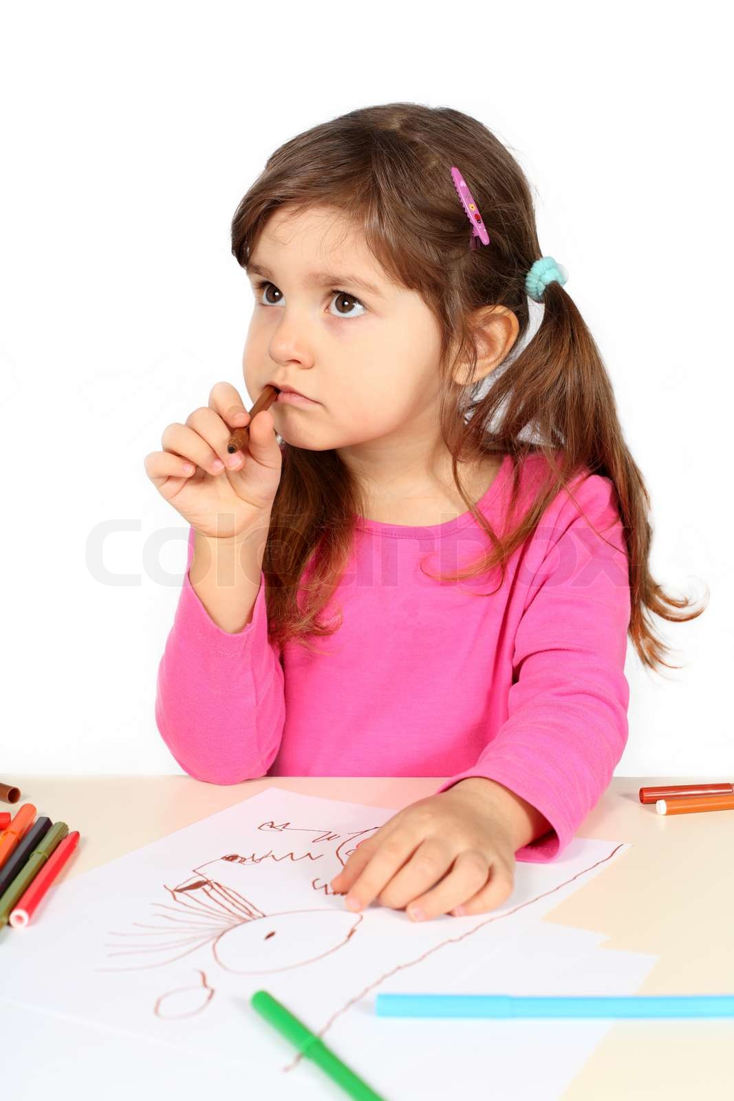 Little Girl Thinking over Drawing | Stock image | Colourbox