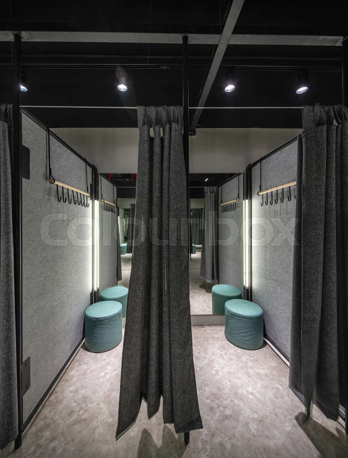 Interior of modern clothes shop with fitting room | Stock image | Colourbox