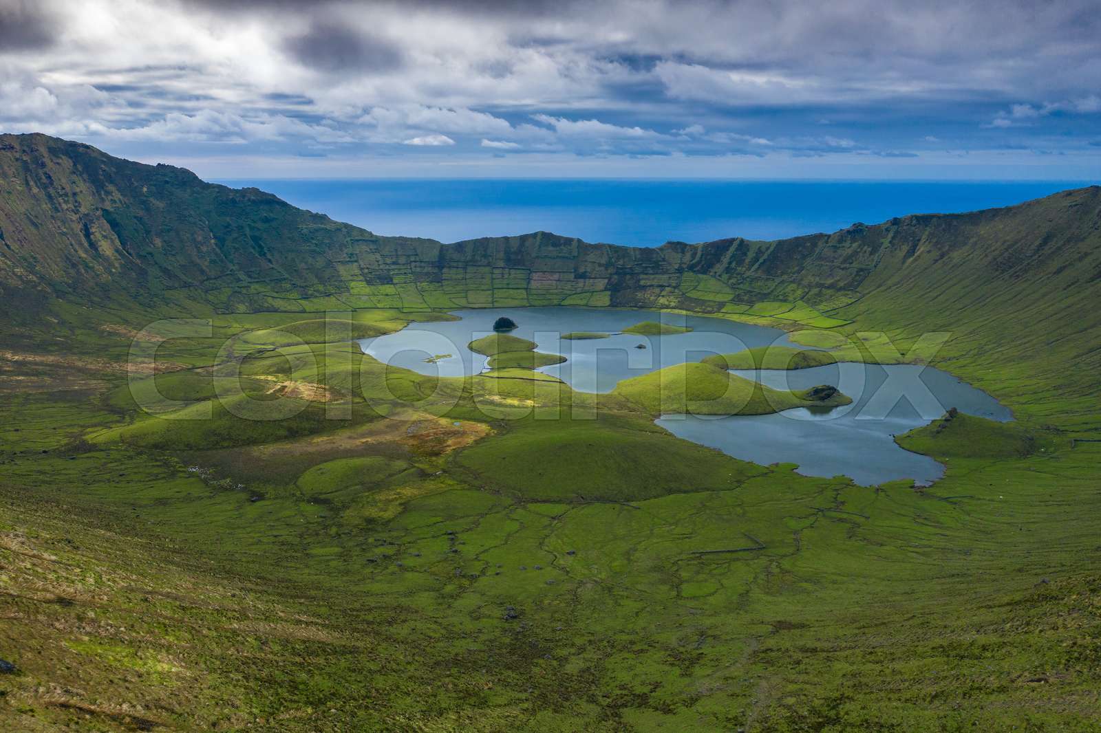 Aerial view of volcanic crater (Caldeirao) with a beautiful lake on the ...