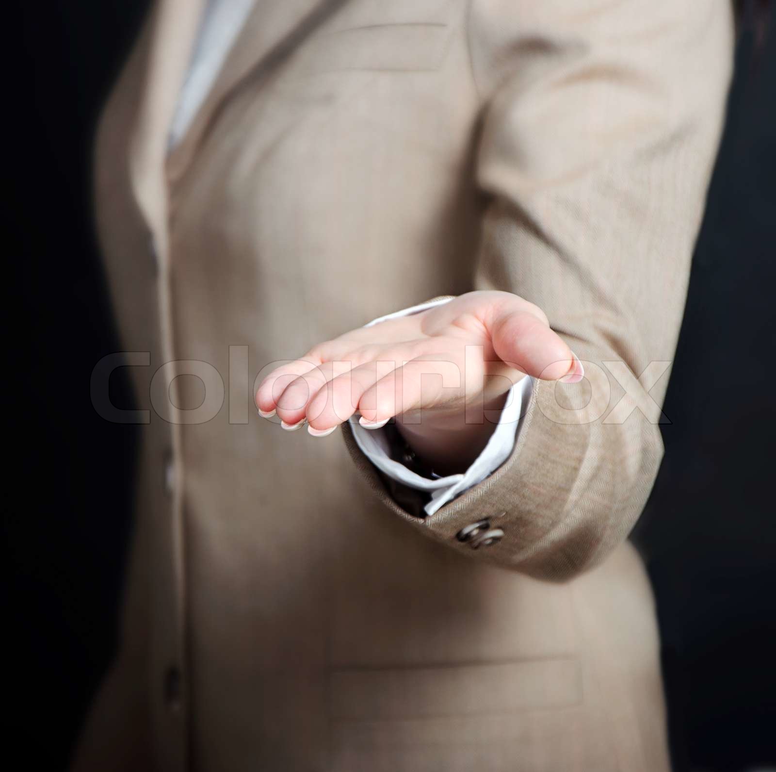 female hand holding showing or giving something | Stock image | Colourbox