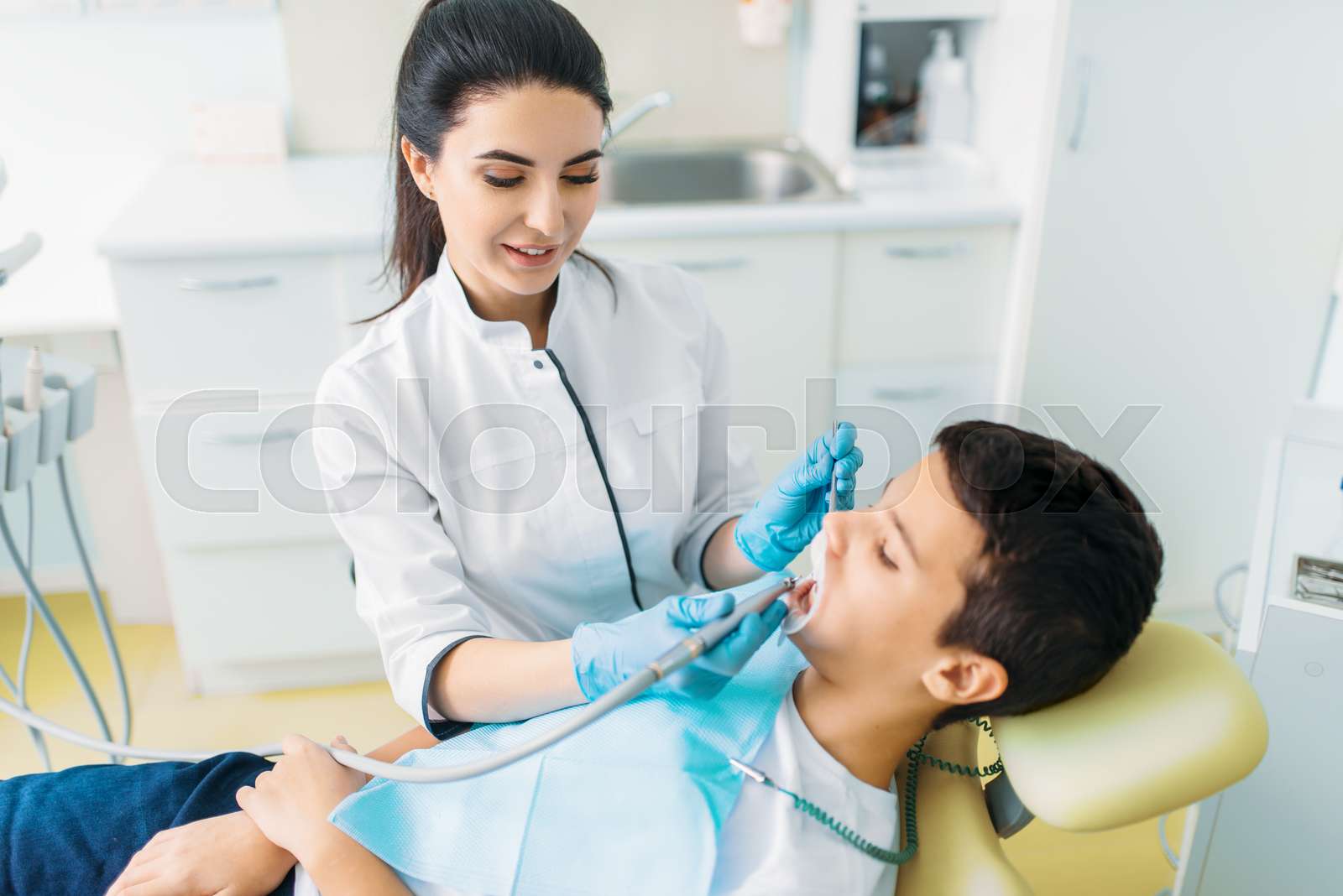 Caries removal procedure, children stomatology | Stock image | Colourbox