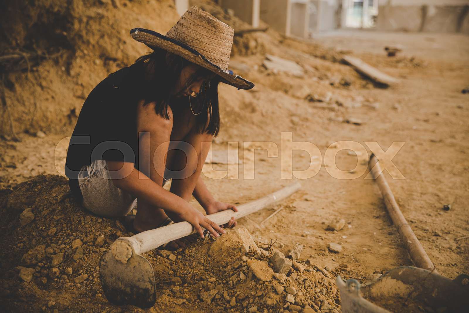 Little girl labor working in commercial building structure, World Day ...