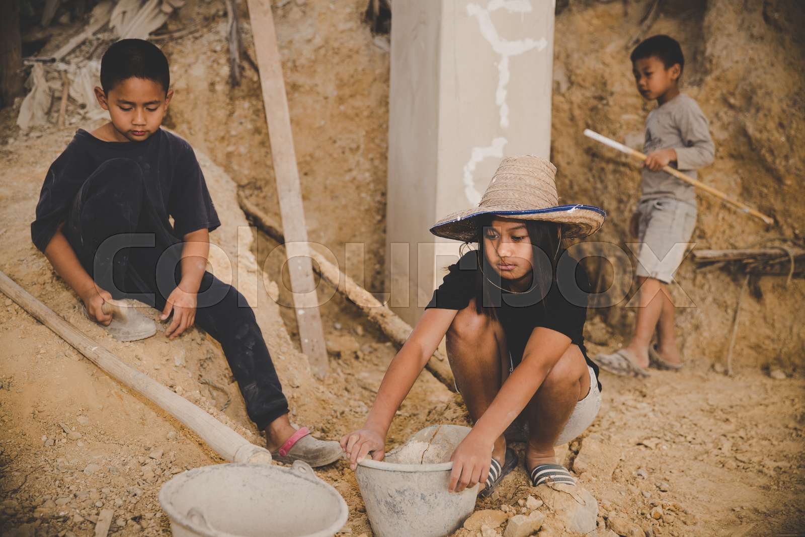 Little boys and girls labor working in commercial building structure ...