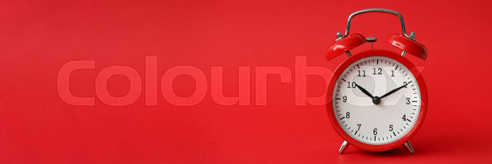 Red alarm clock show 10 hour vintage modern | Stock image | Colourbox
