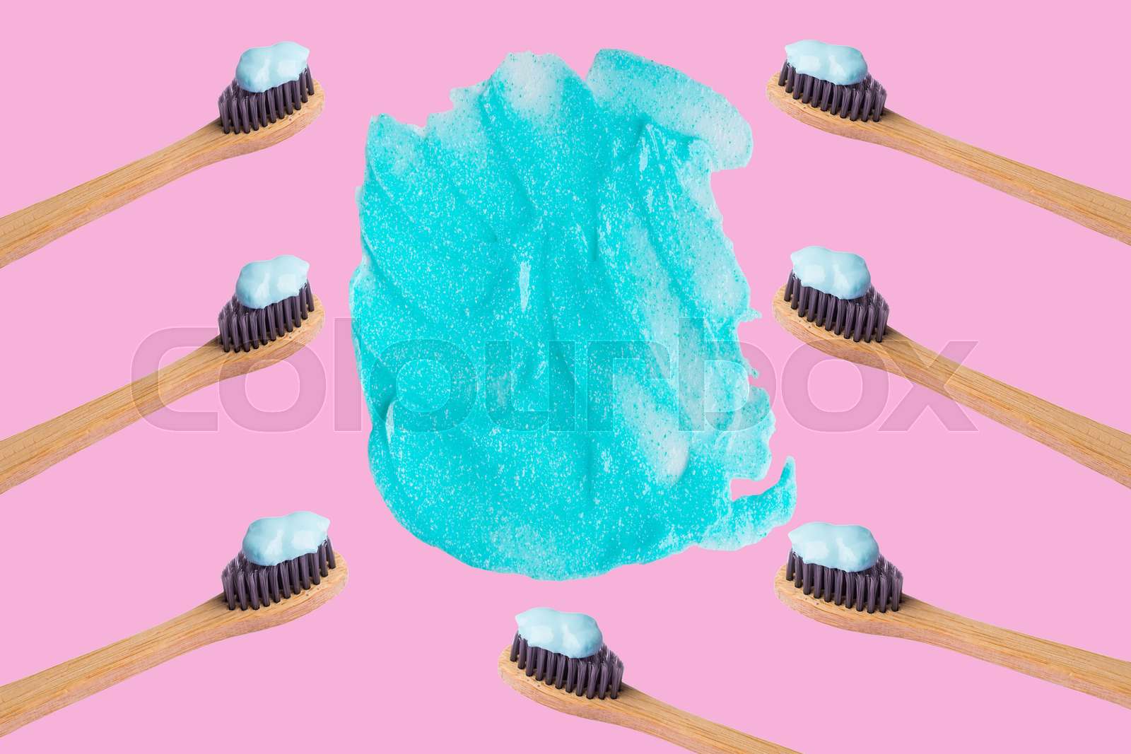 Toothbrushes frame with toothpaste on pink | Stock image | Colourbox