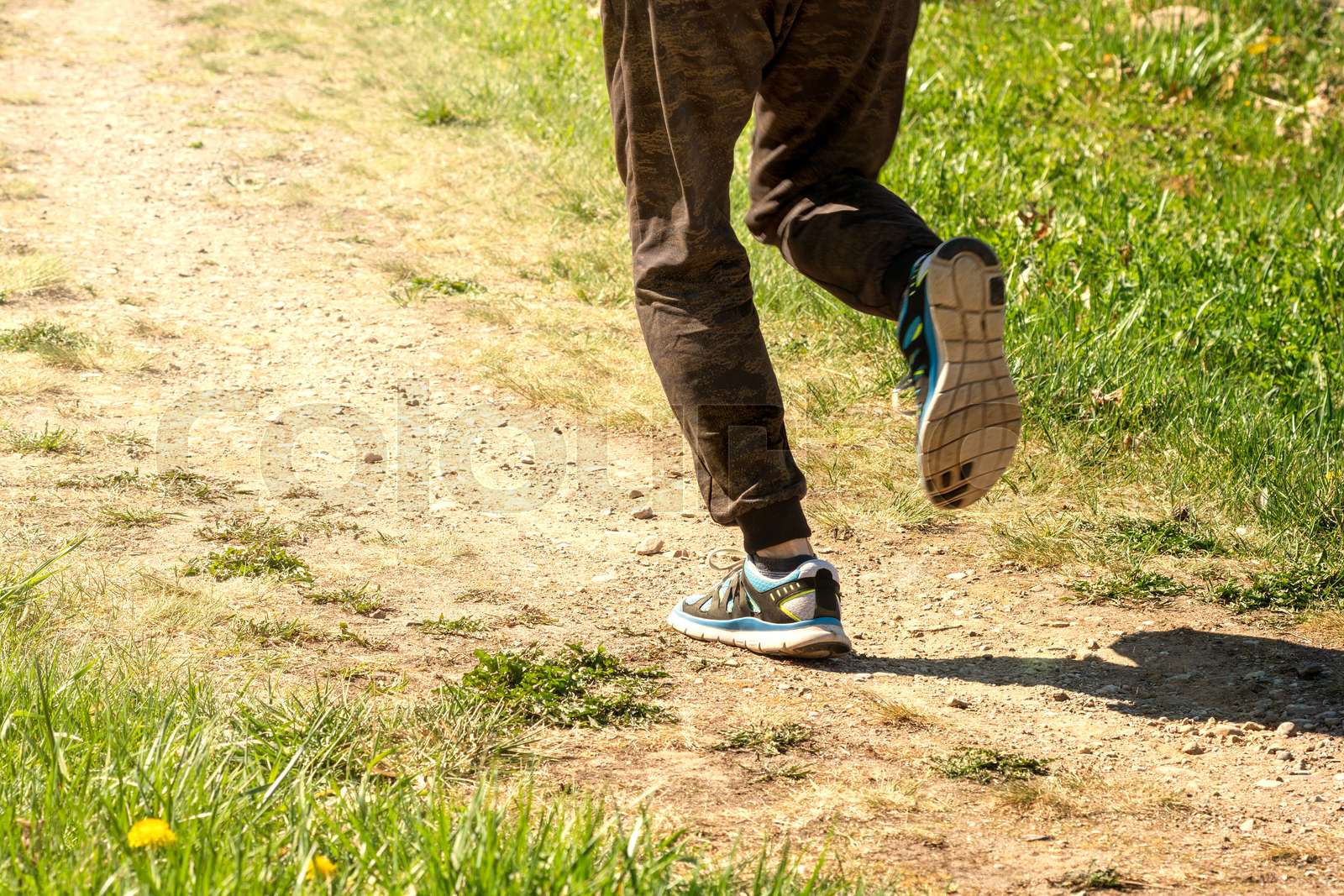 Runner man running on a rural road | Stock image | Colourbox