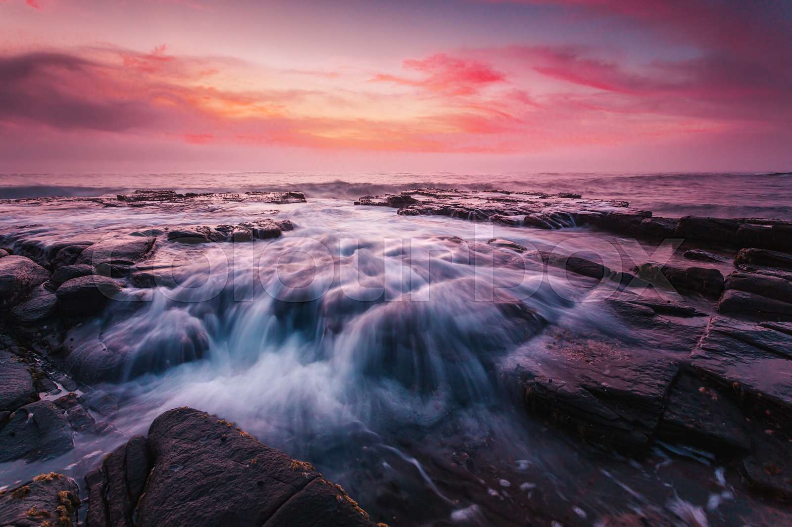 Sunrise at the tessellated rocks of Garie Beach Australia | Stock image ...