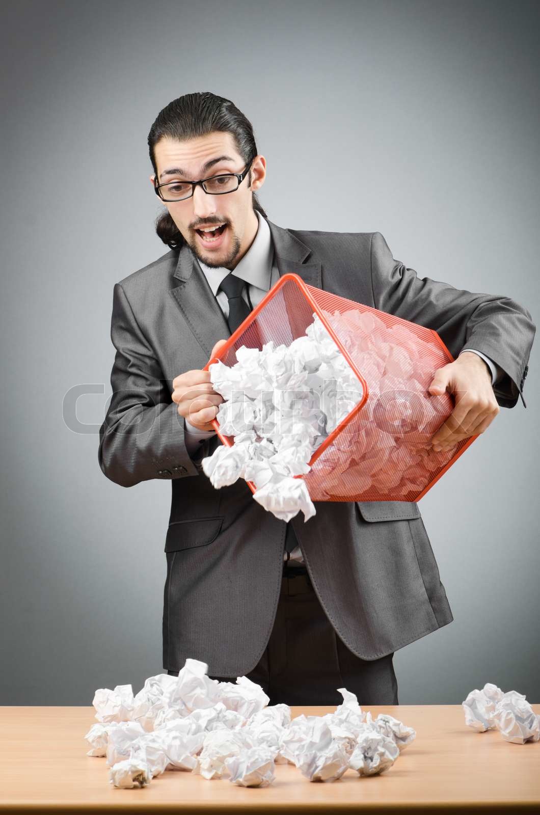 Man with lots of wasted paper | Stock image | Colourbox