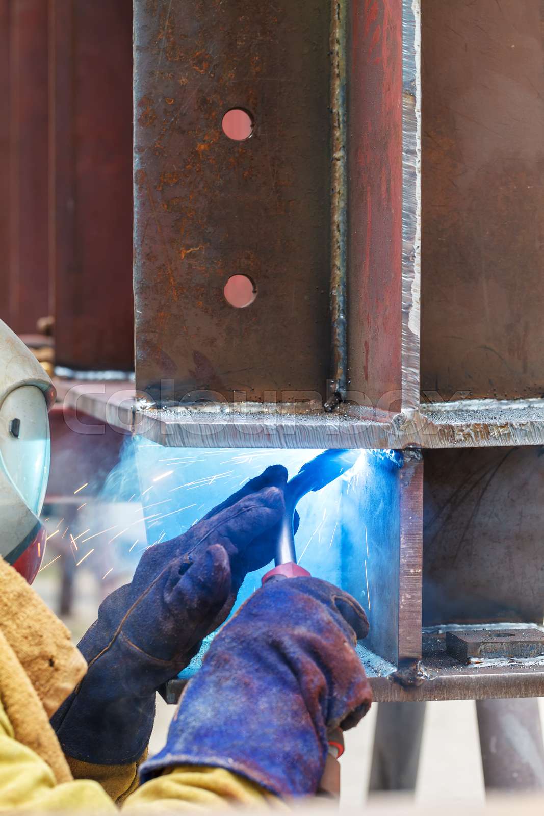 Worker welding in a factory. Welding on an industrial plant. | Stock ...