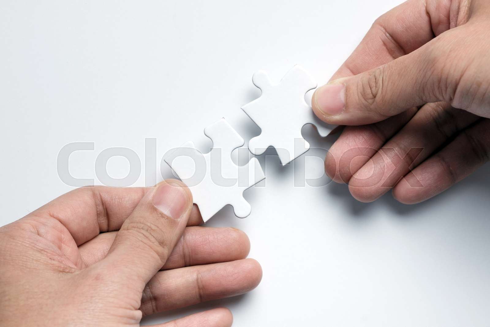 Partnership concept with hands putting puzzle pieces together | Stock ...