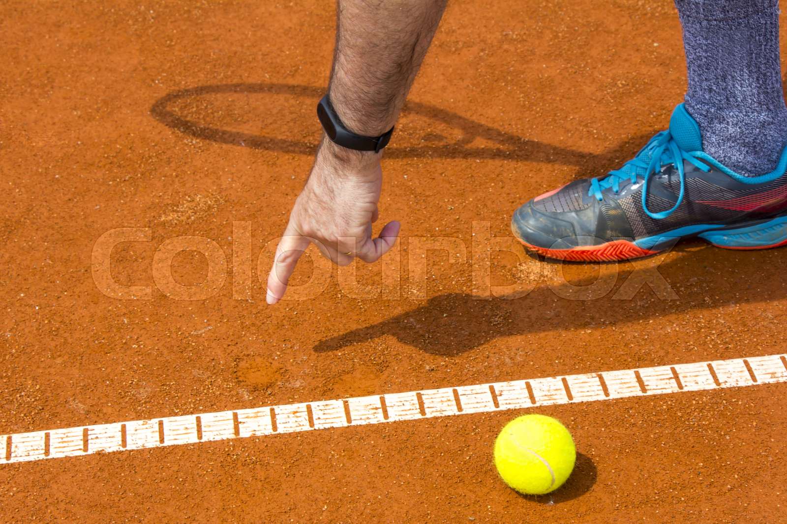 Tennis player shows the track on the tennis court | Stock image | Colourbox