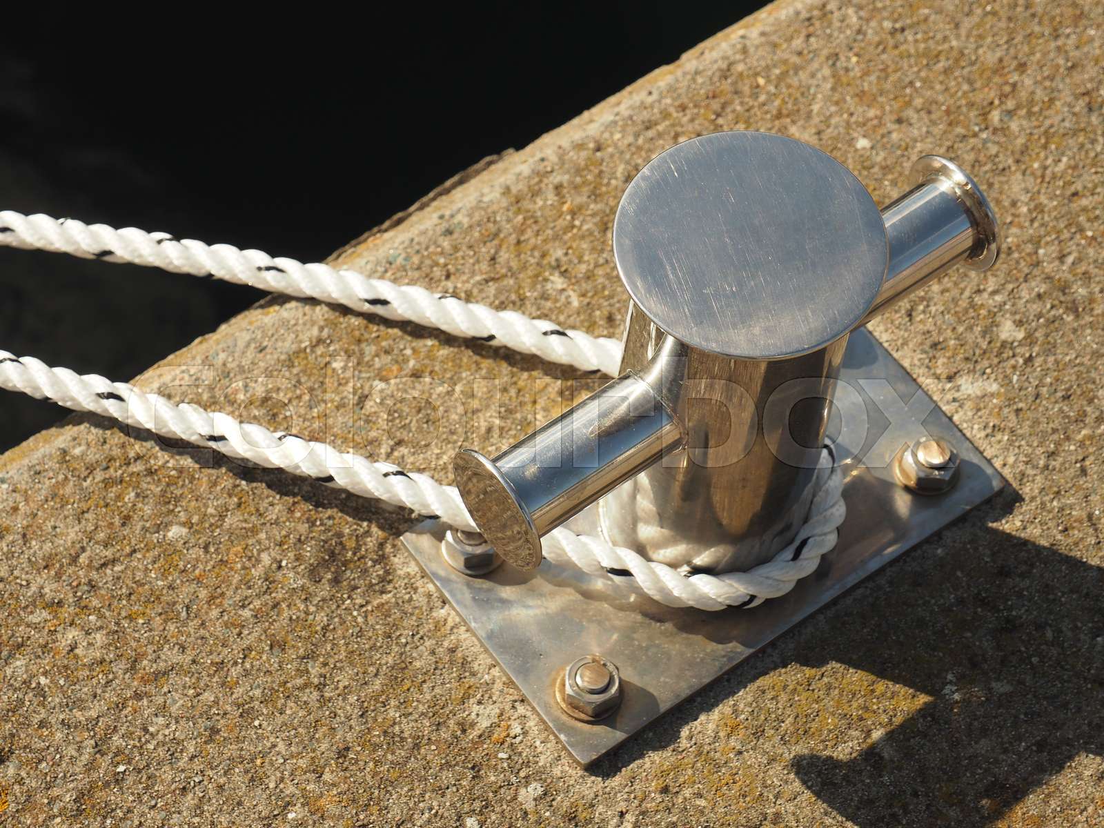 Stainless steel bollard with a rope | Stock image | Colourbox