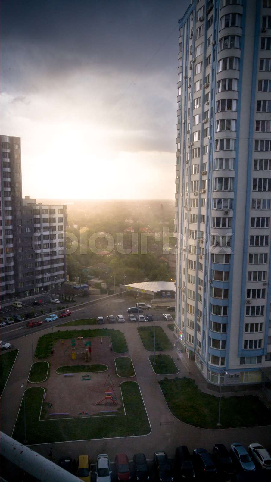 Beautiful aerial photo of high living building in sun ray at sunrise ...
