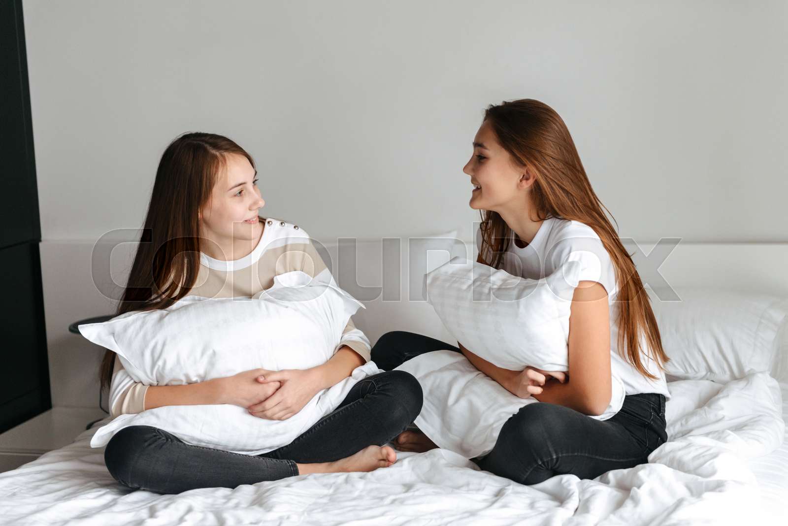 Two cheerful young teenage girls talking | Stock image | Colourbox