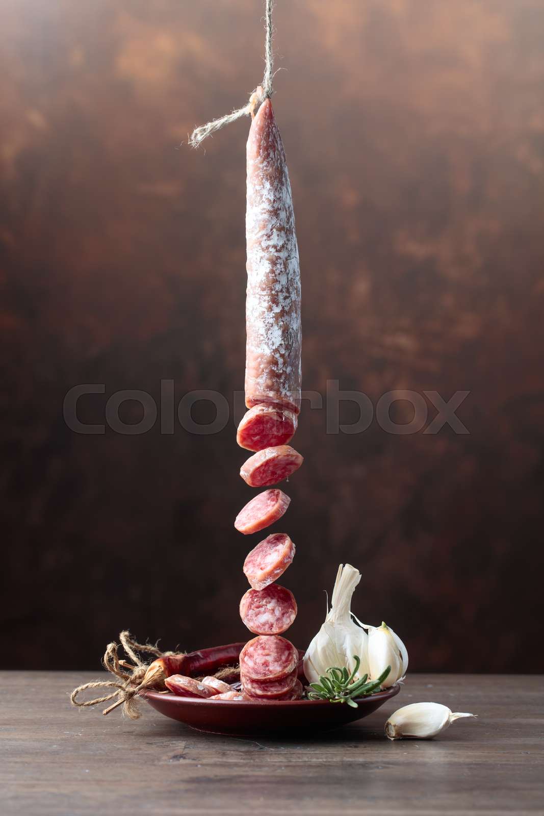 Dry-cured sausage with rosemary, garlic and red pepper. | Stock image ...