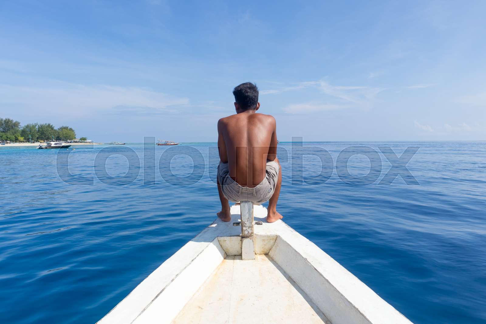 Local Sporty Guy Sitting Topless at the Bow of Traditional White Wooden ...