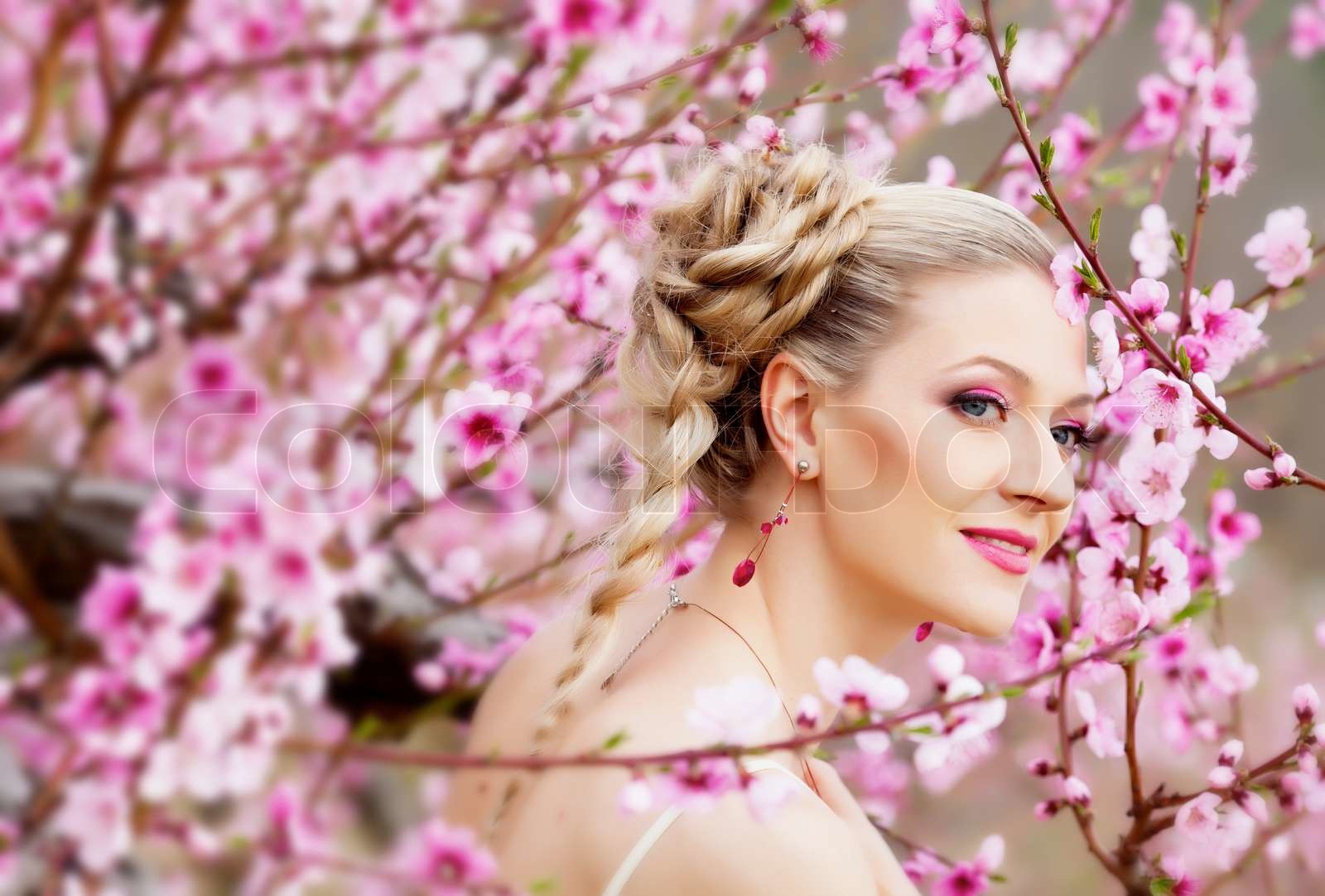 Bride in blossom garden | Stock image | Colourbox