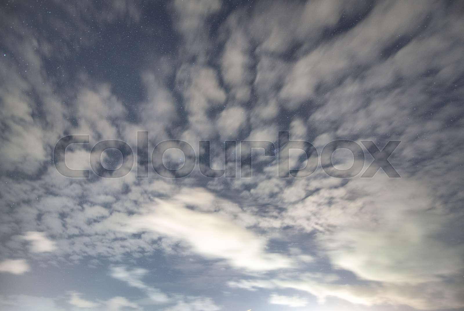 Cloudy sky with stars at night | Stock image | Colourbox