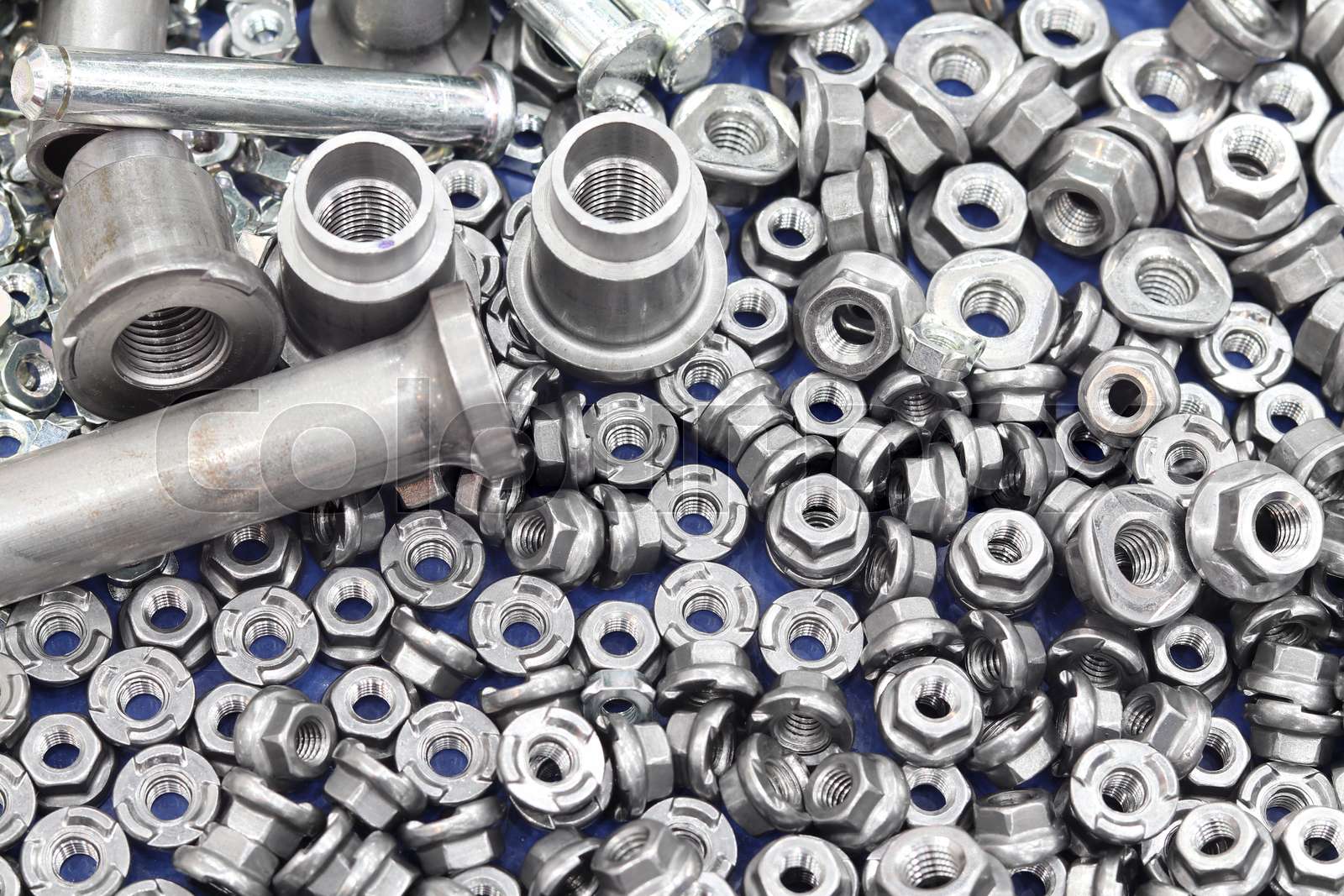 small bolts and nuts by manufacturing process | Stock image | Colourbox