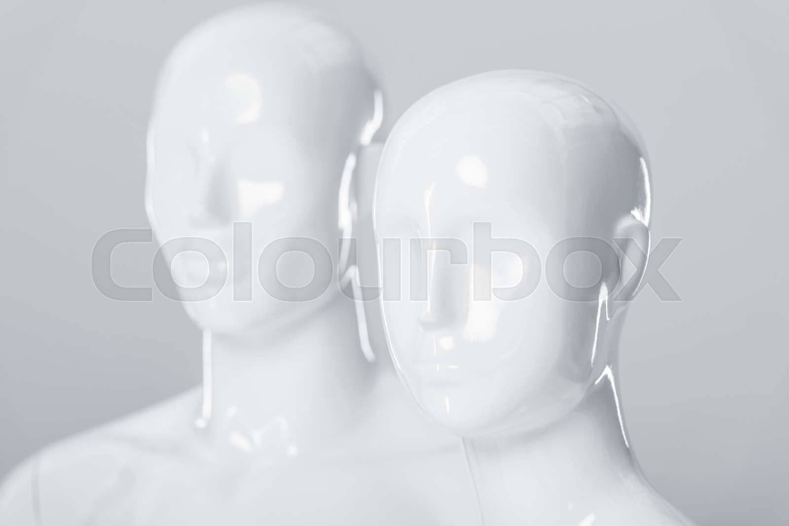 minimalistic white plastic mannequin dummies on grey | Stock image ...