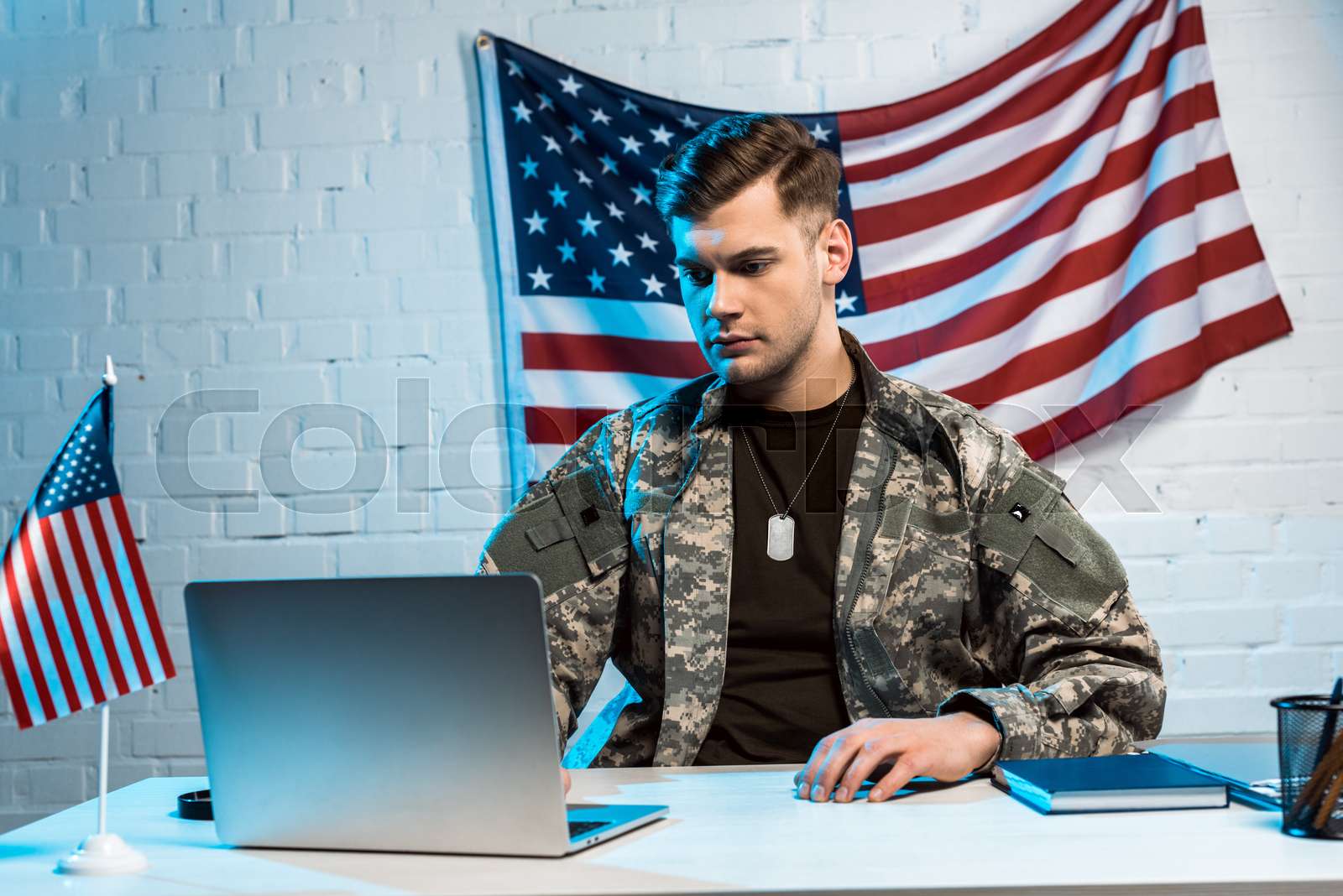 handsome soldier in uniform using laptop in office | Stock image ...