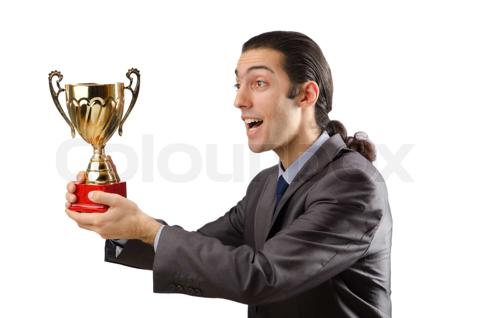 Man being awarded with golden cup | Stock image | Colourbox