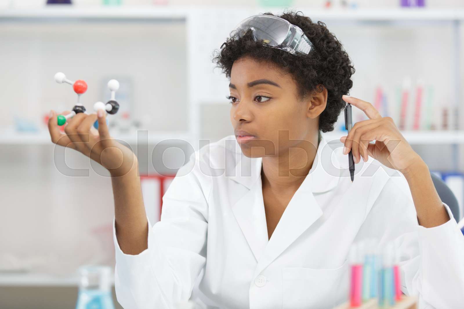beautiful female scientist holding molecule model | Stock image | Colourbox