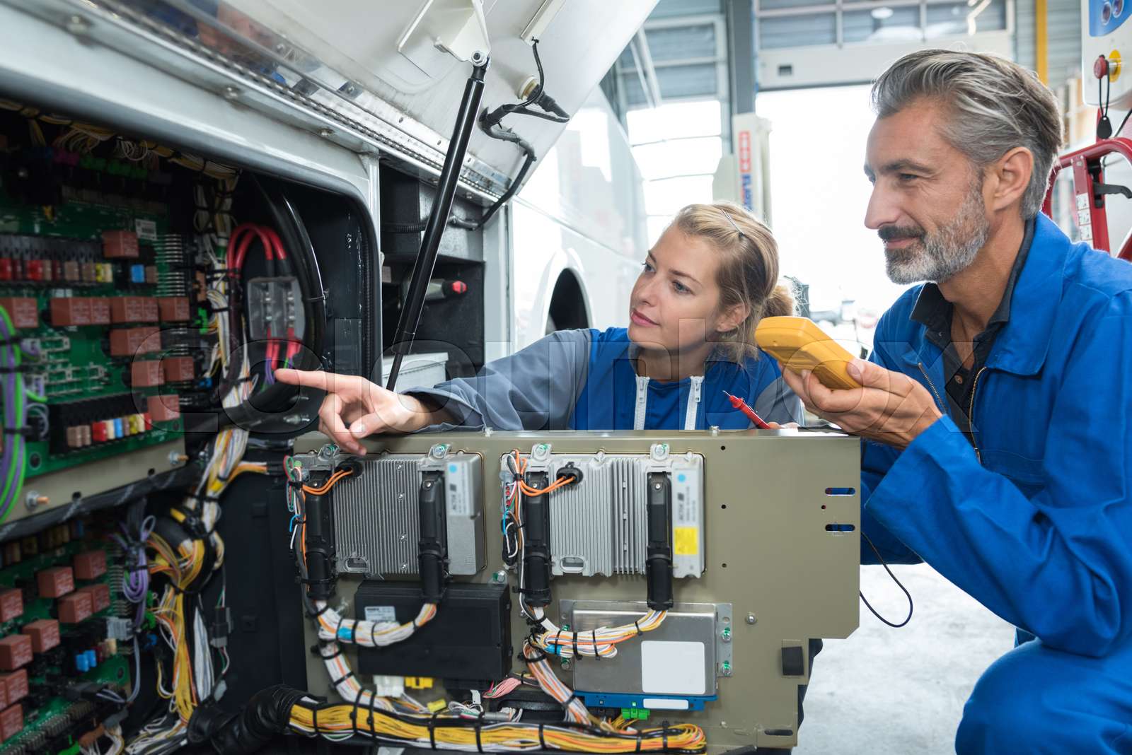 male and female bus mechanics | Stock image | Colourbox
