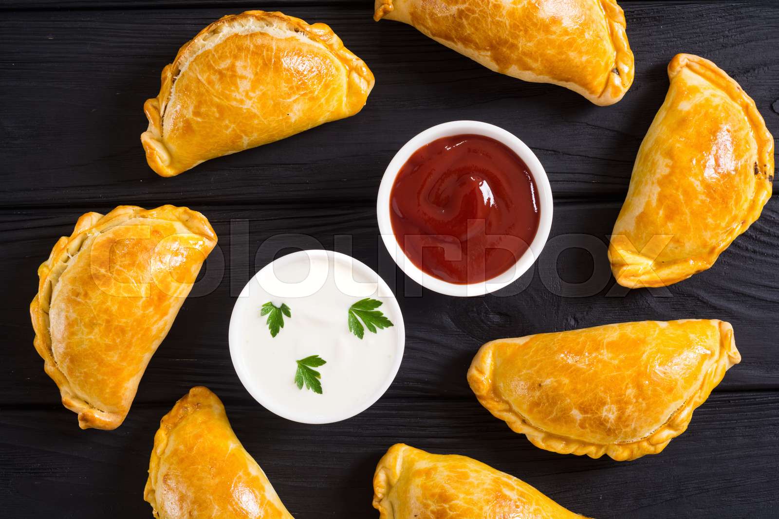 Latin American baked beef empanadas with sauce | Stock image | Colourbox
