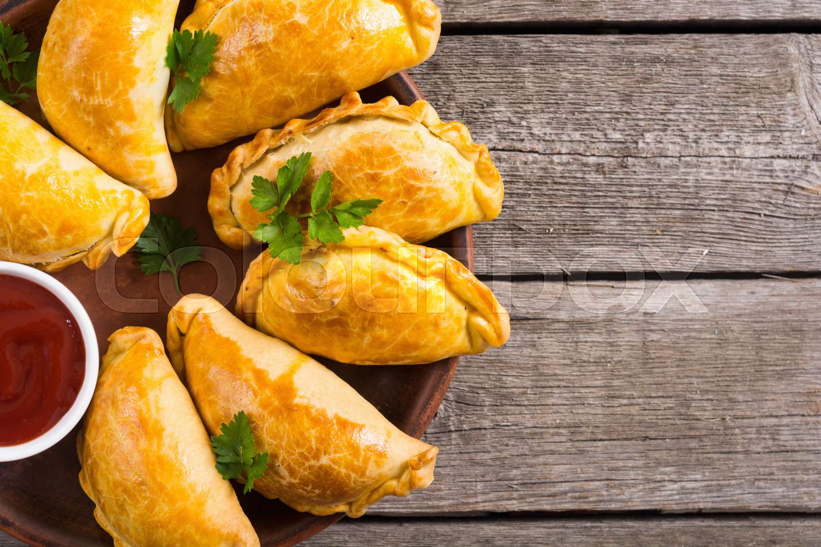 Latin American baked beef empanadas with sauce | Stock image | Colourbox