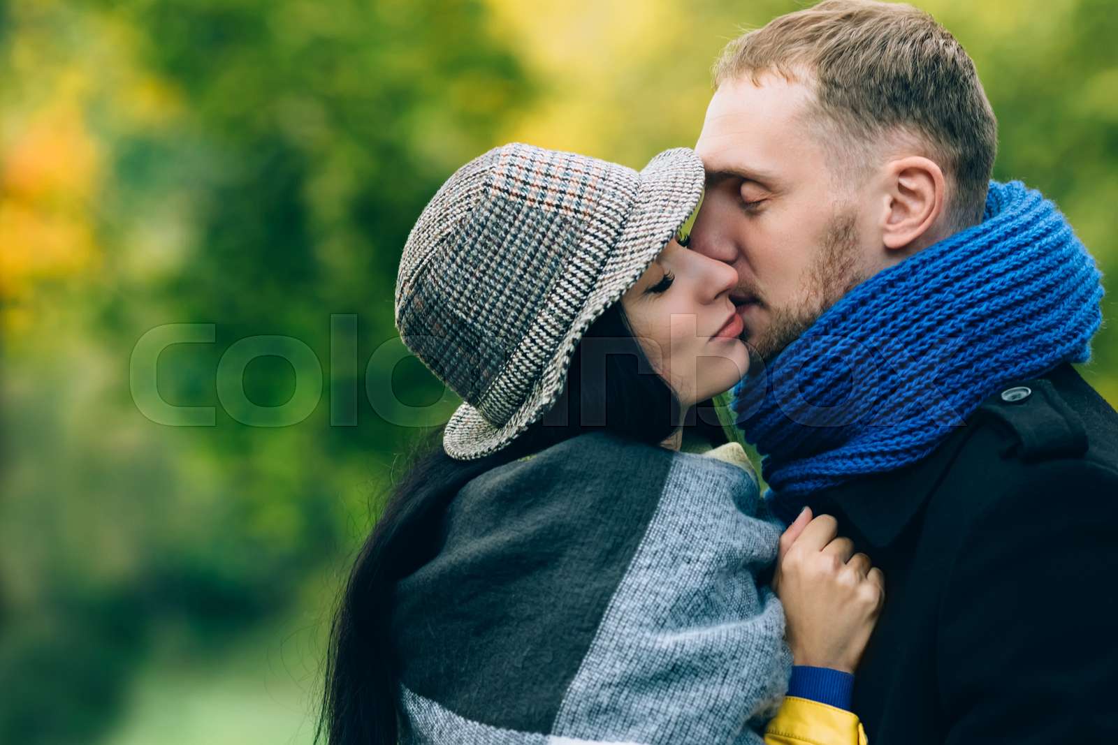 Young people in autumn park. Yellow Trees and Leaves. Happy young ...