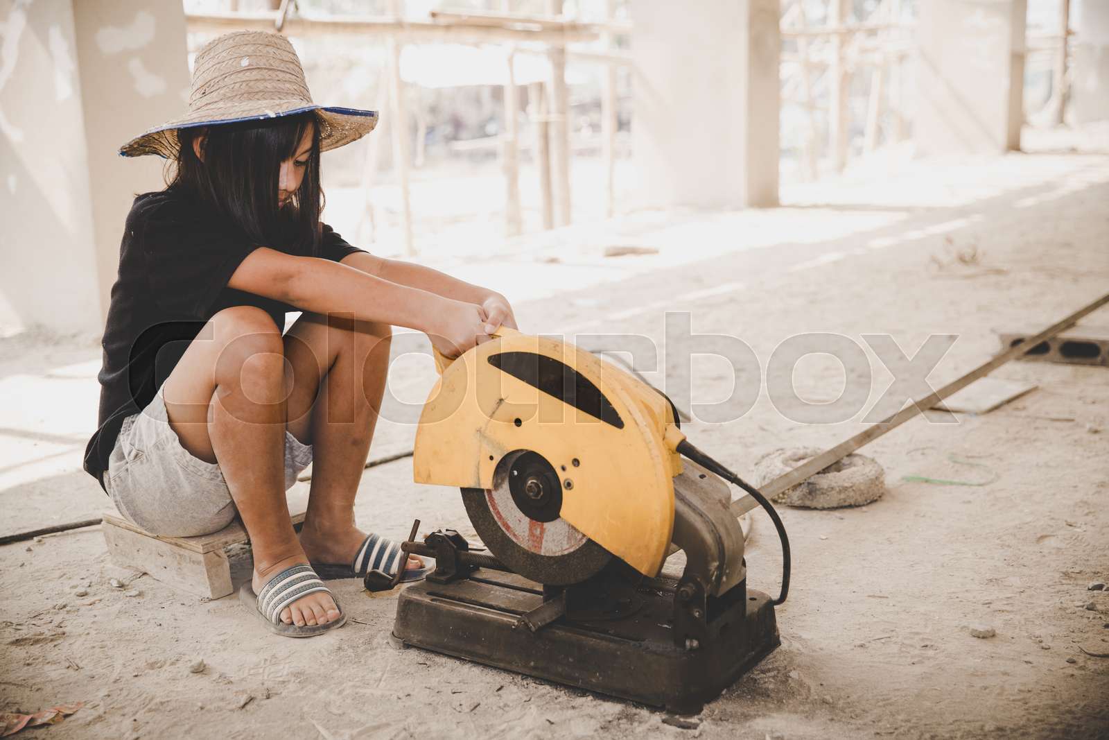 Little girl labor working in commercial building structure, World Day ...