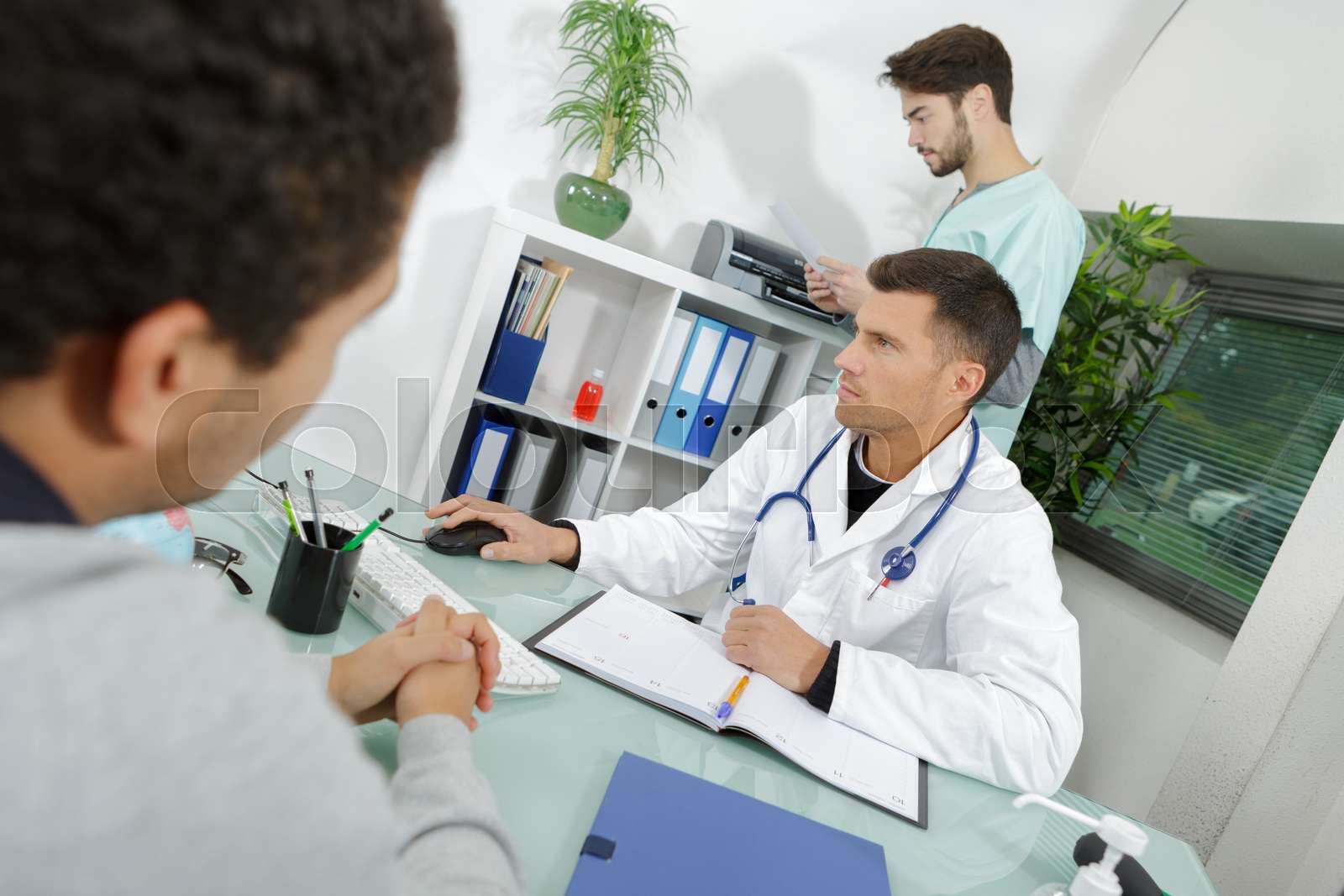 doctor with patient | Stock image | Colourbox
