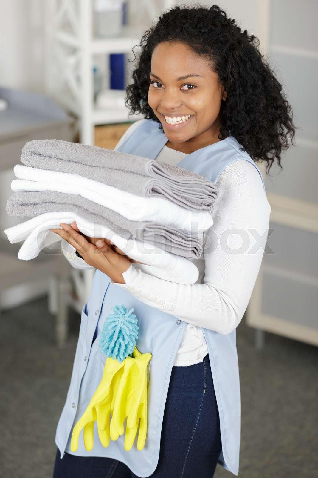 maid with of laundry basket | Stock image | Colourbox