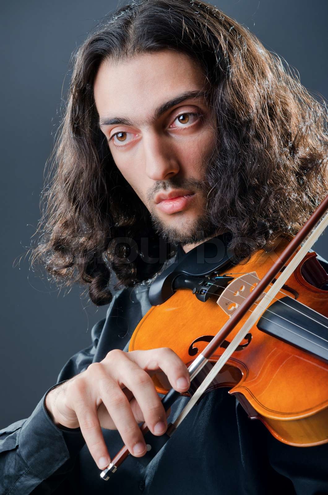 Violin player playing the intstrument | Stock image | Colourbox