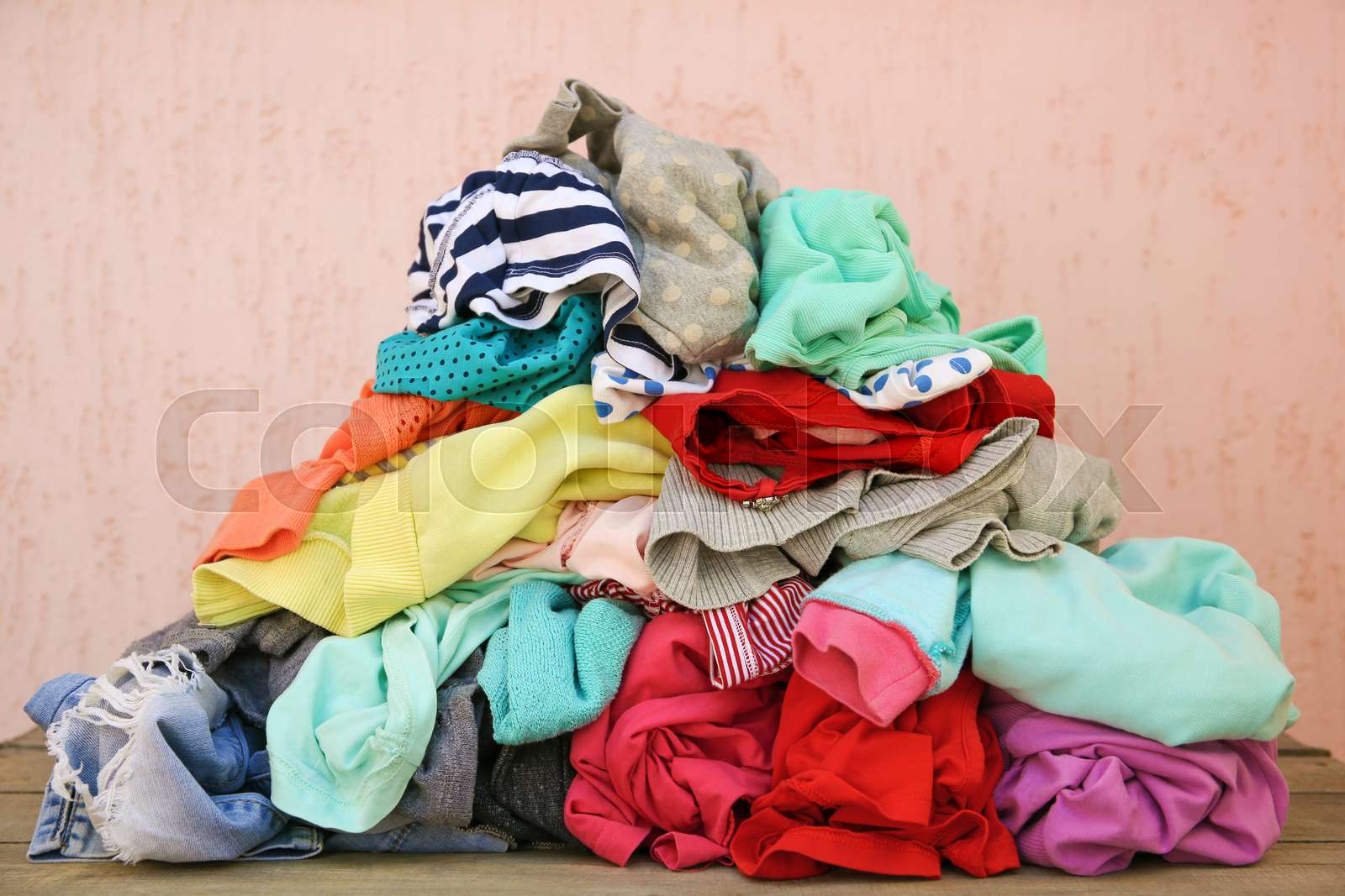 Pile of carelessly scattered clothes. | Stock image | Colourbox