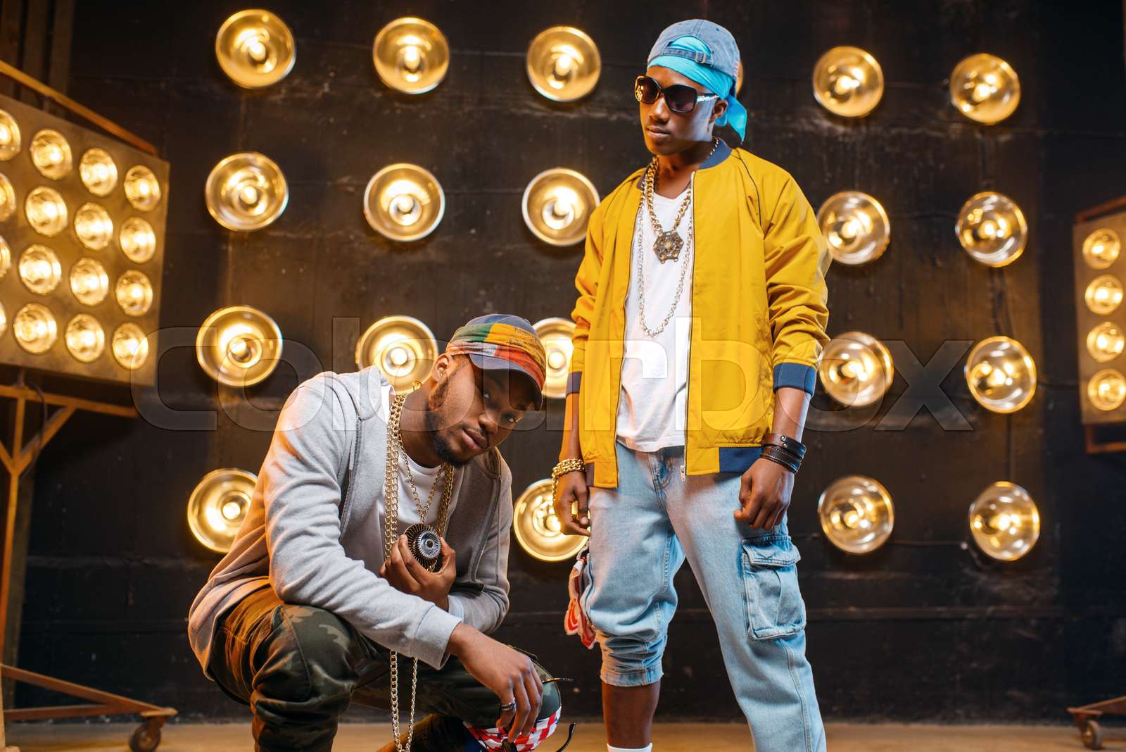 Two black rappers in caps, perfomance in club | Stock image | Colourbox