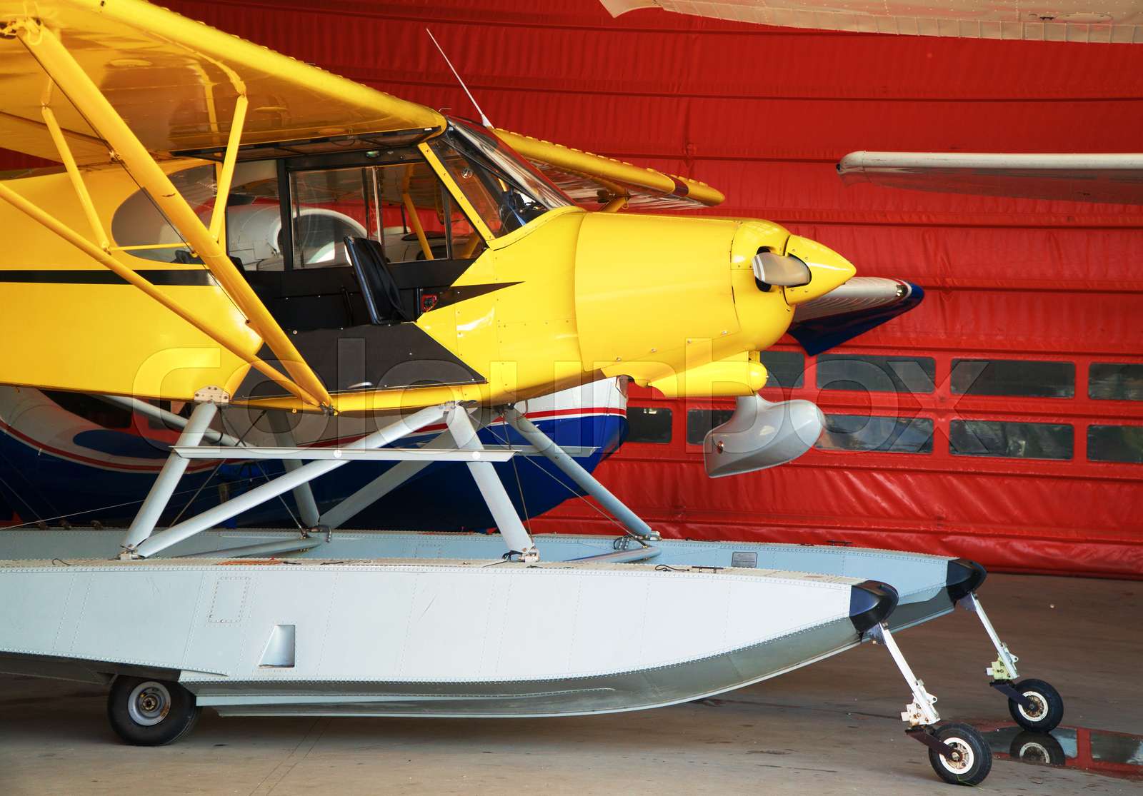 Close-up view of floatplanes (seaplanes) standing in hangar. | Stock ...