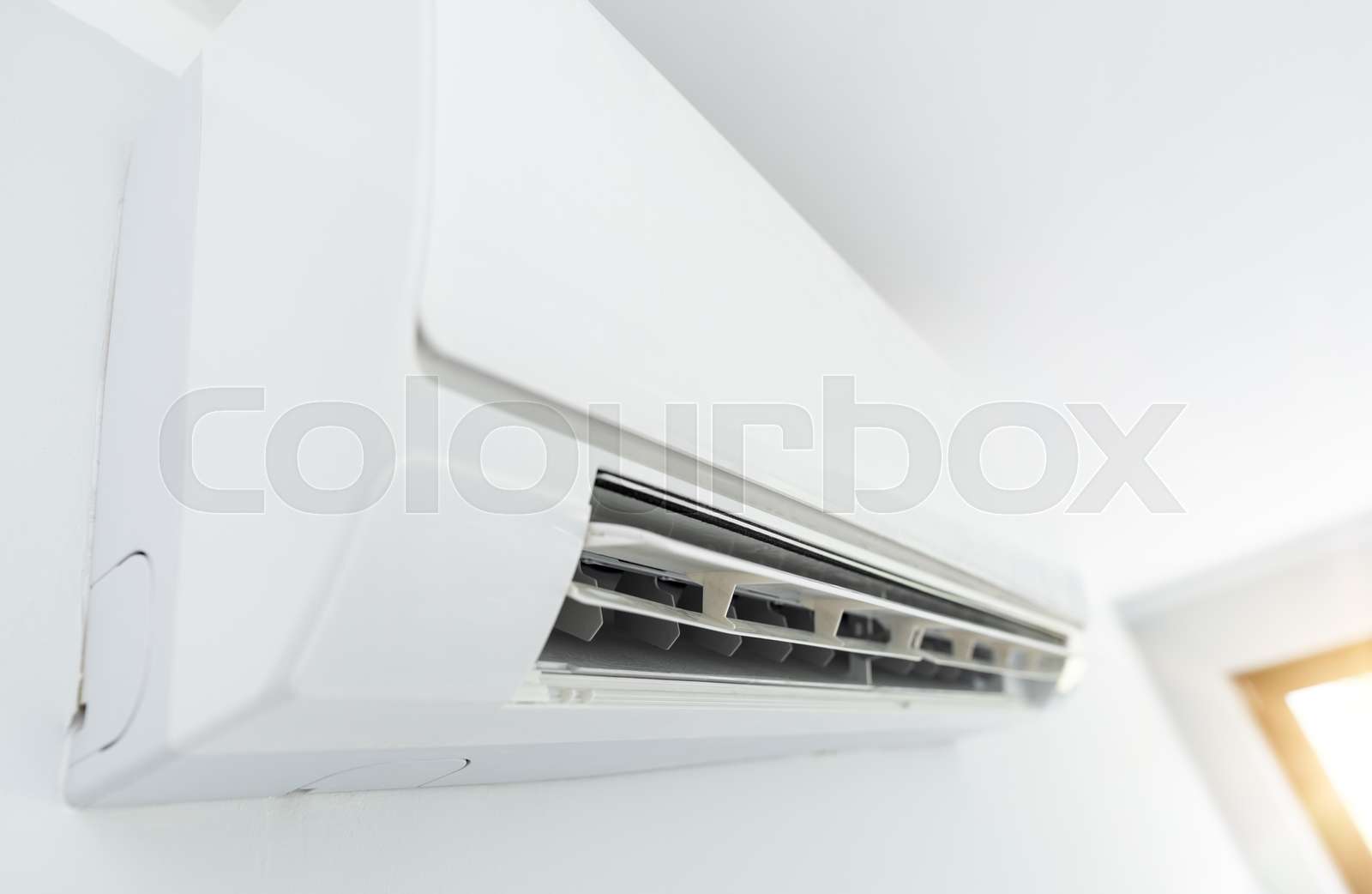 Air conditioner split hanging on the wall | Stock image | Colourbox