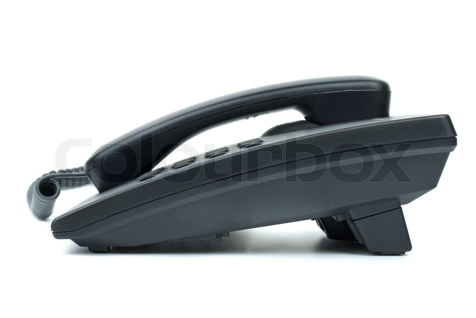 Black office phone Side view | Stock image | Colourbox