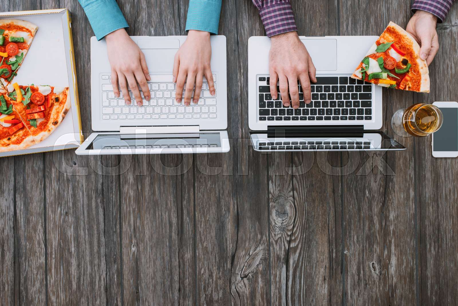 Lunch break at office desk | Stock image | Colourbox