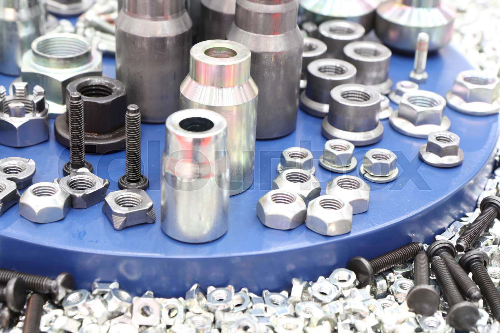 small bolts and nuts by manufacturing process | Stock image | Colourbox