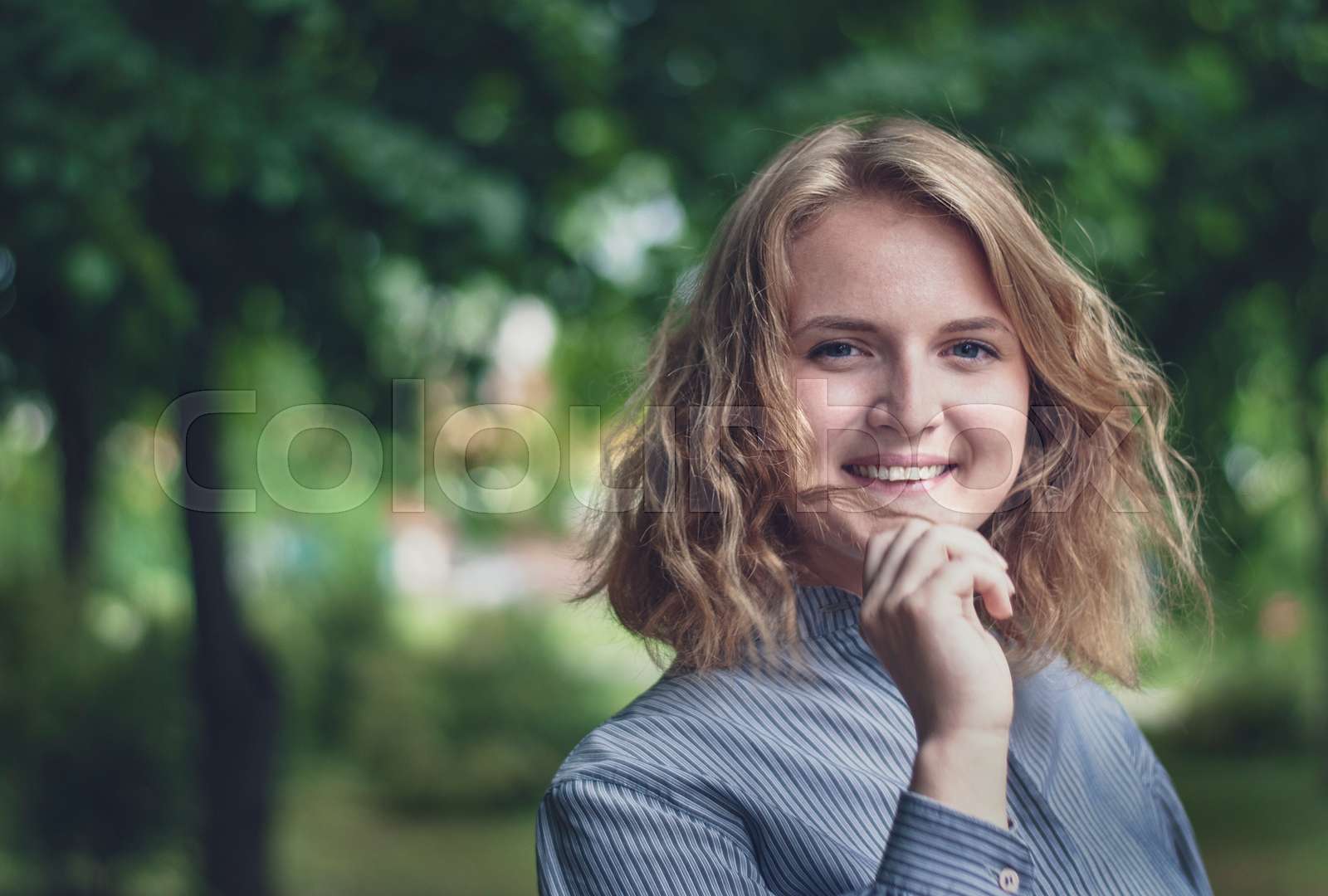 Happy attractive blond woman looking back | Stock image | Colourbox
