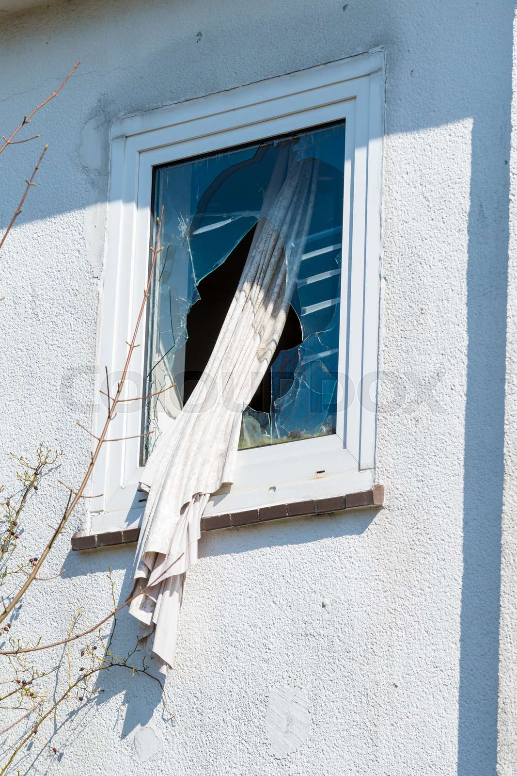 Broken window in a building. The concept of vandalism | Stock image ...