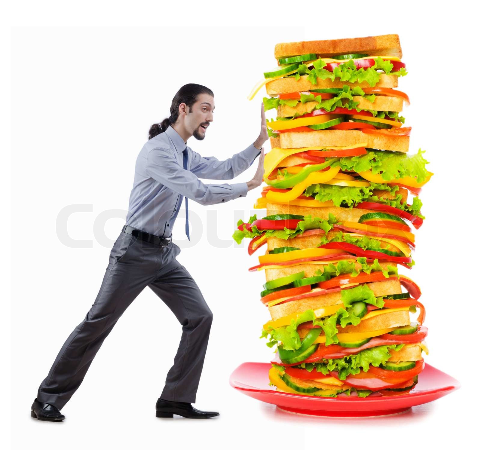 Man and giant sandwich on white | Stock image | Colourbox