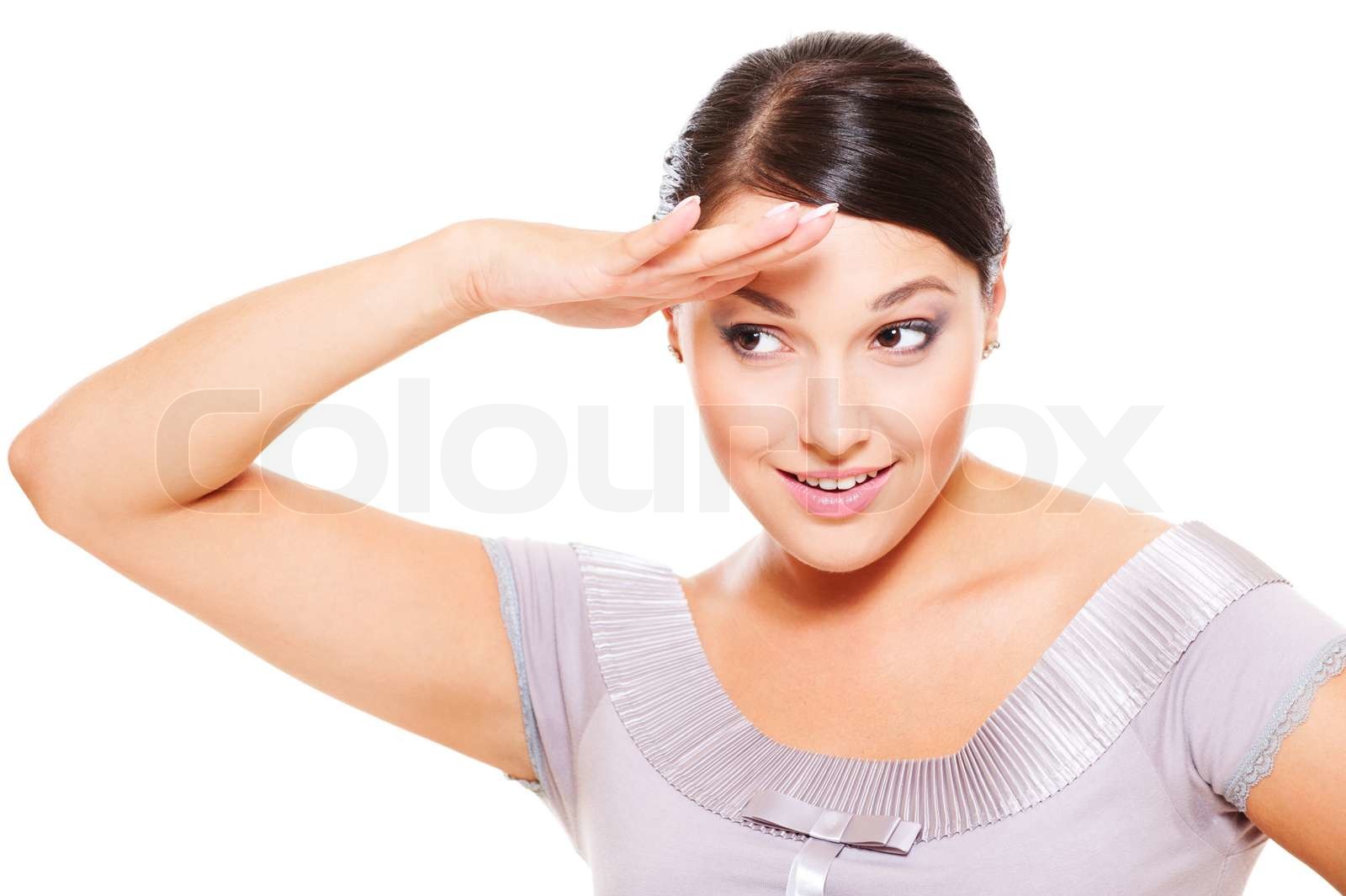 pretty woman looking forward and having put her palm to forehead ...