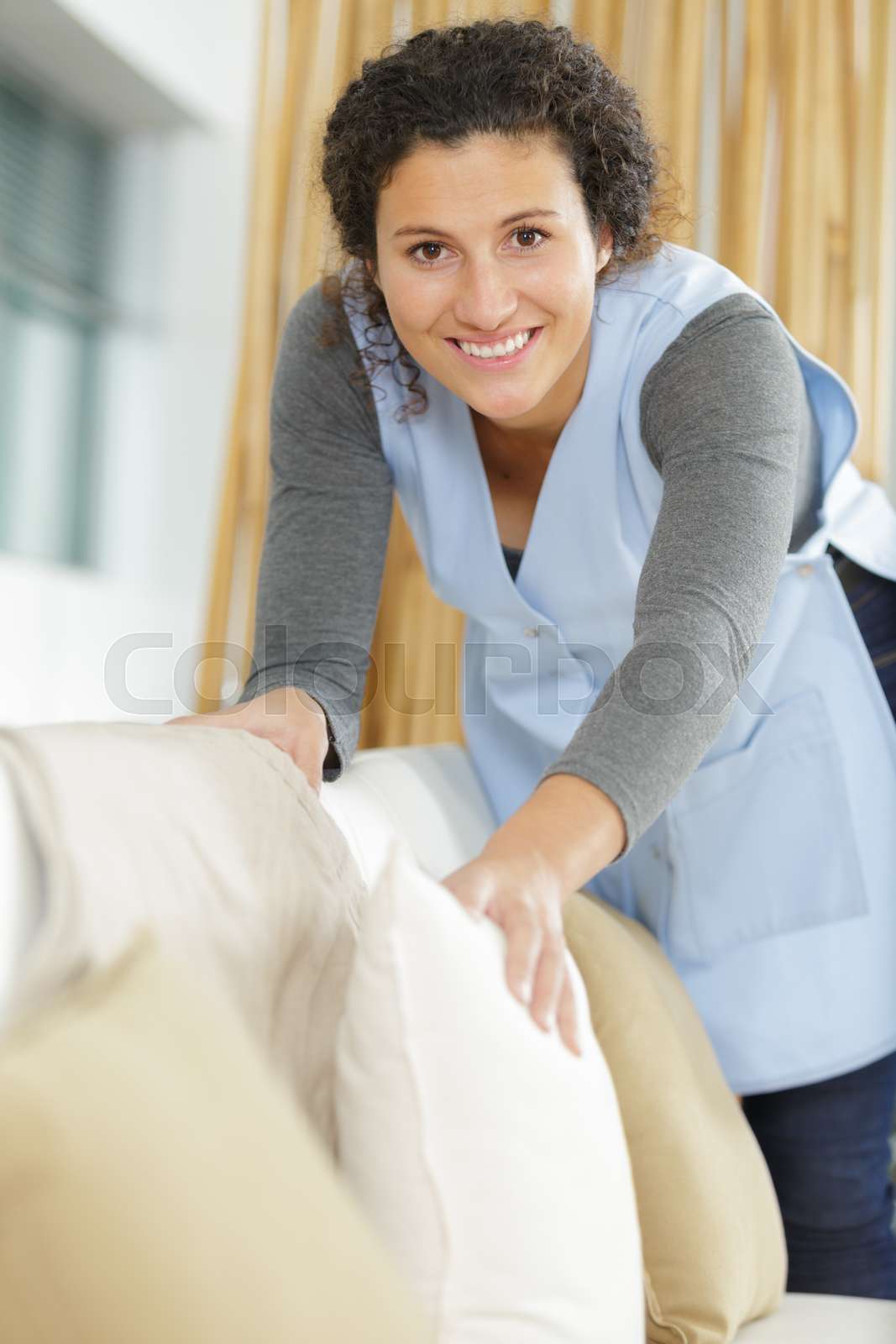 housekeeper cleaning a hotel room | Stock image | Colourbox